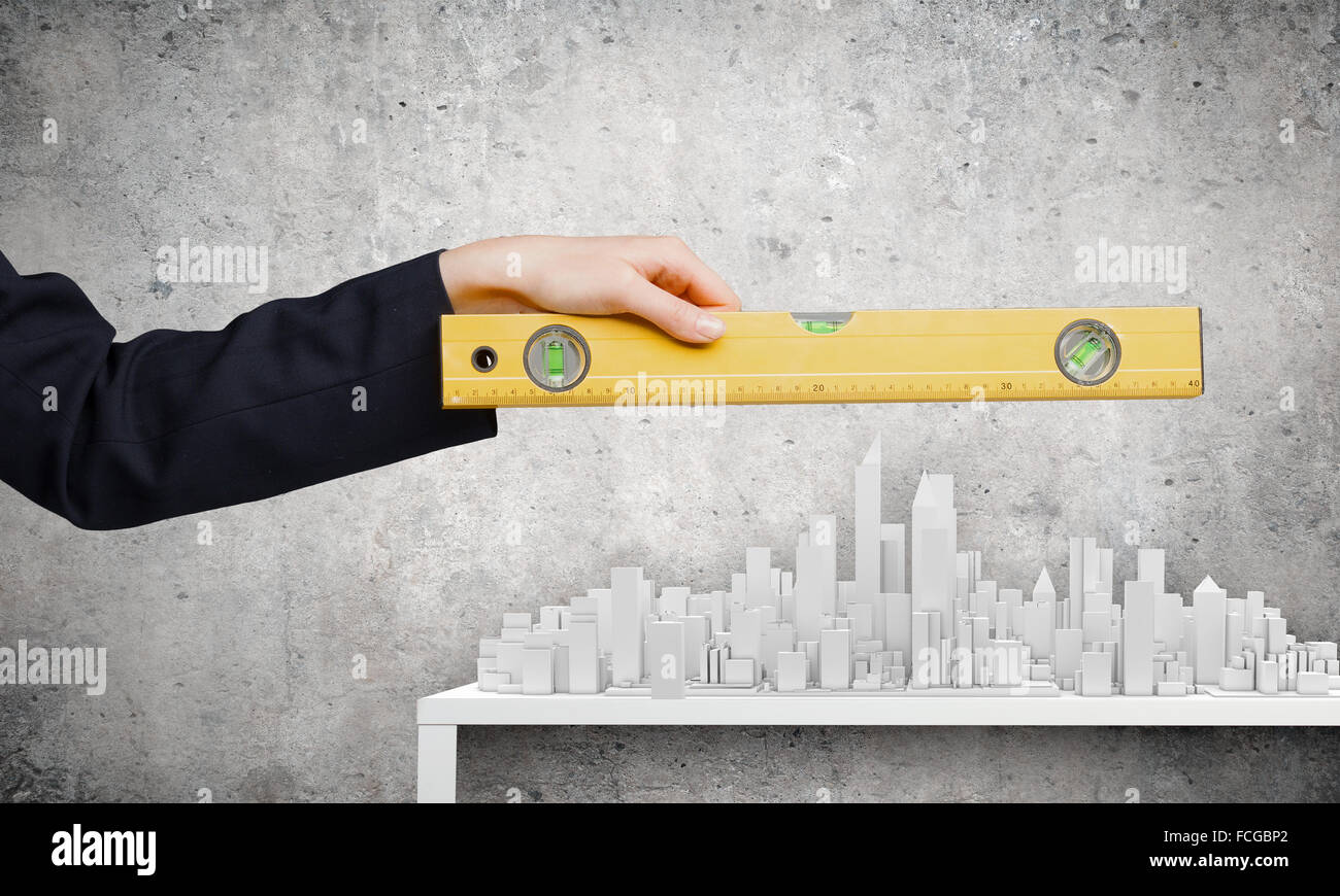 Close up of female hand measuring construction project with ruler Stock ...