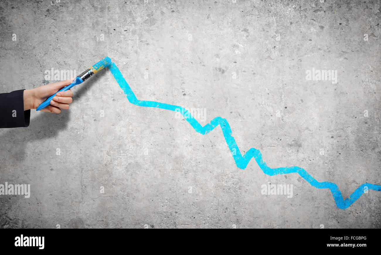 Close up of hand drawing increasing graph with paint brush Stock Photo ...