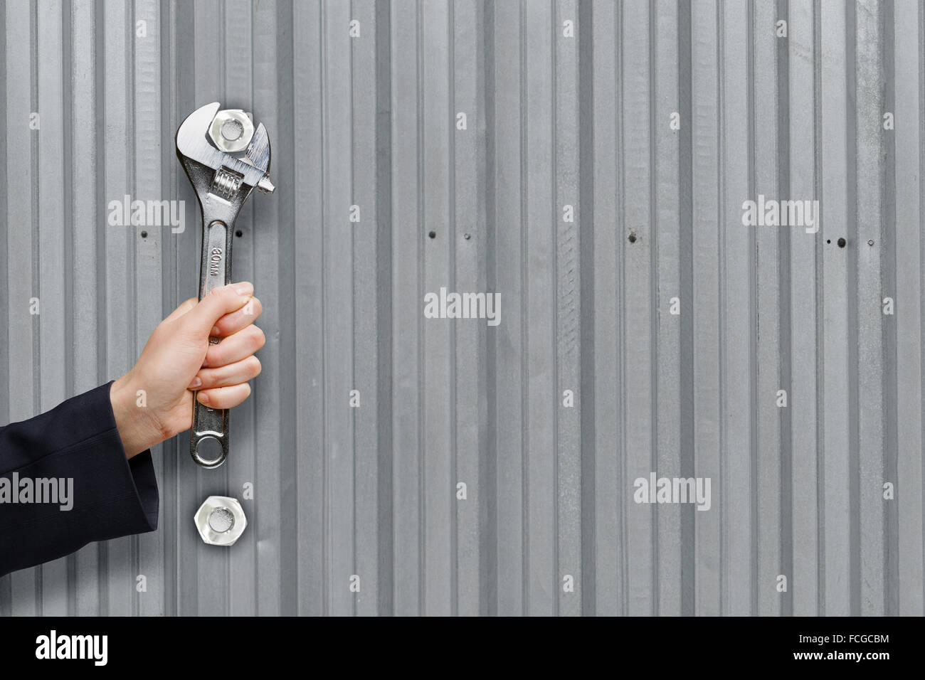 Close up of businessman hand fixing mechanism with spanner Stock Photo ...