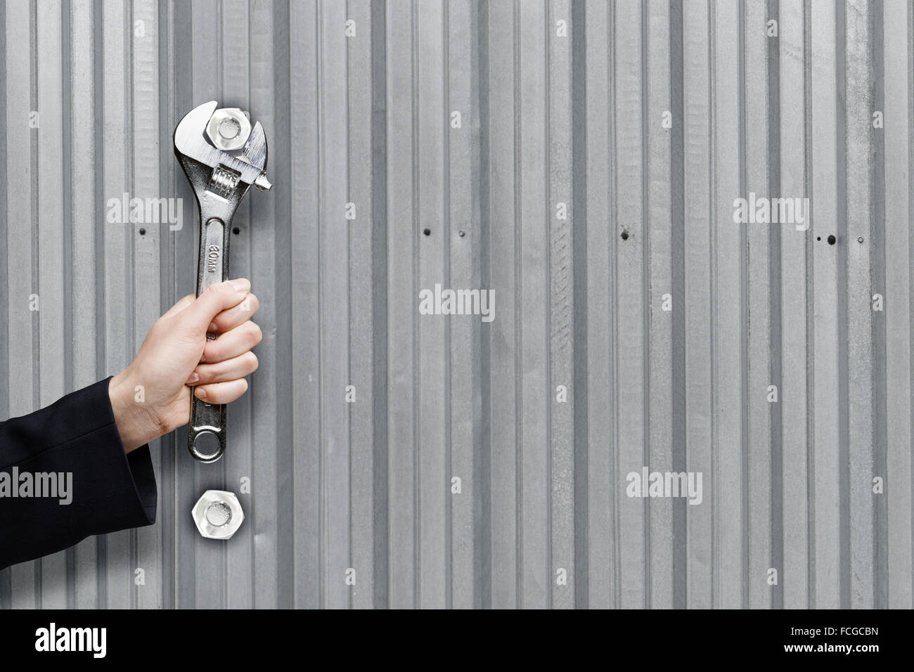Close up of businessman hand fixing mechanism with spanner Stock Photo ...