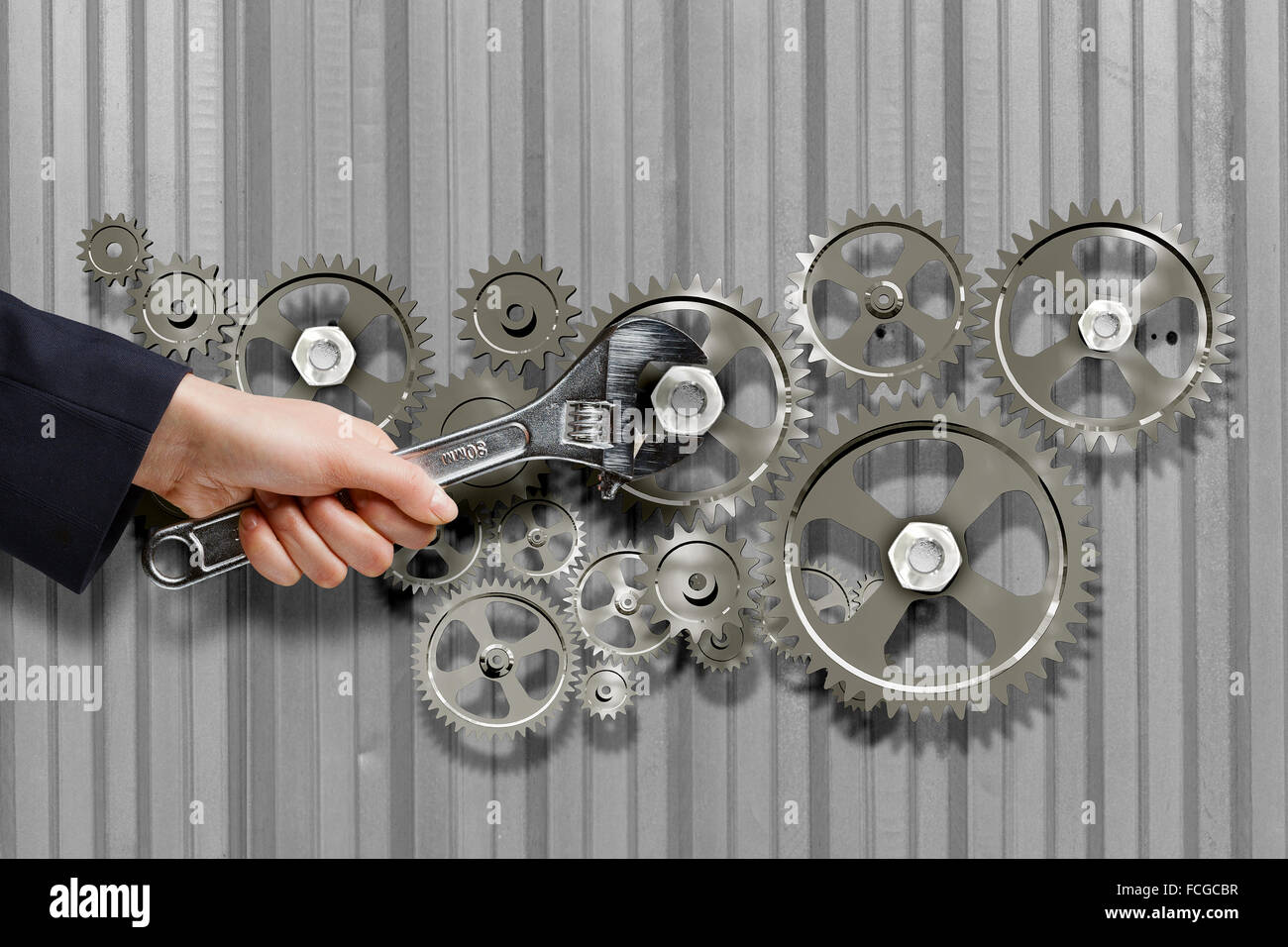 Close up of businessman hand fixing mechanism with spanner Stock Photo ...