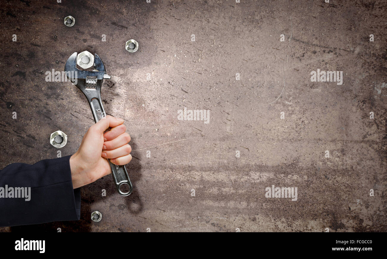 Close up of businessman hand fixing mechanism with spanner Stock Photo ...