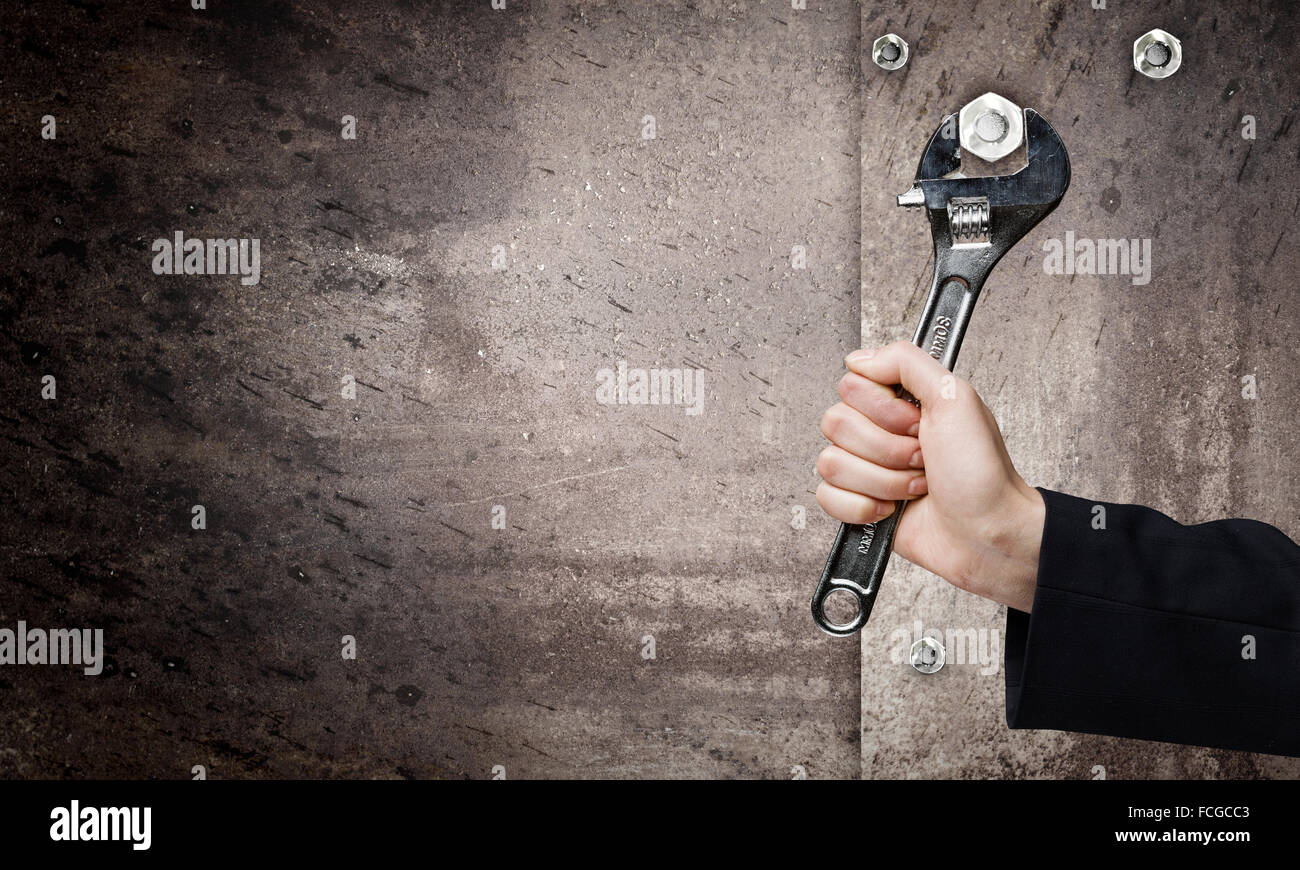 Close up of businessman hand fixing mechanism with spanner Stock Photo ...