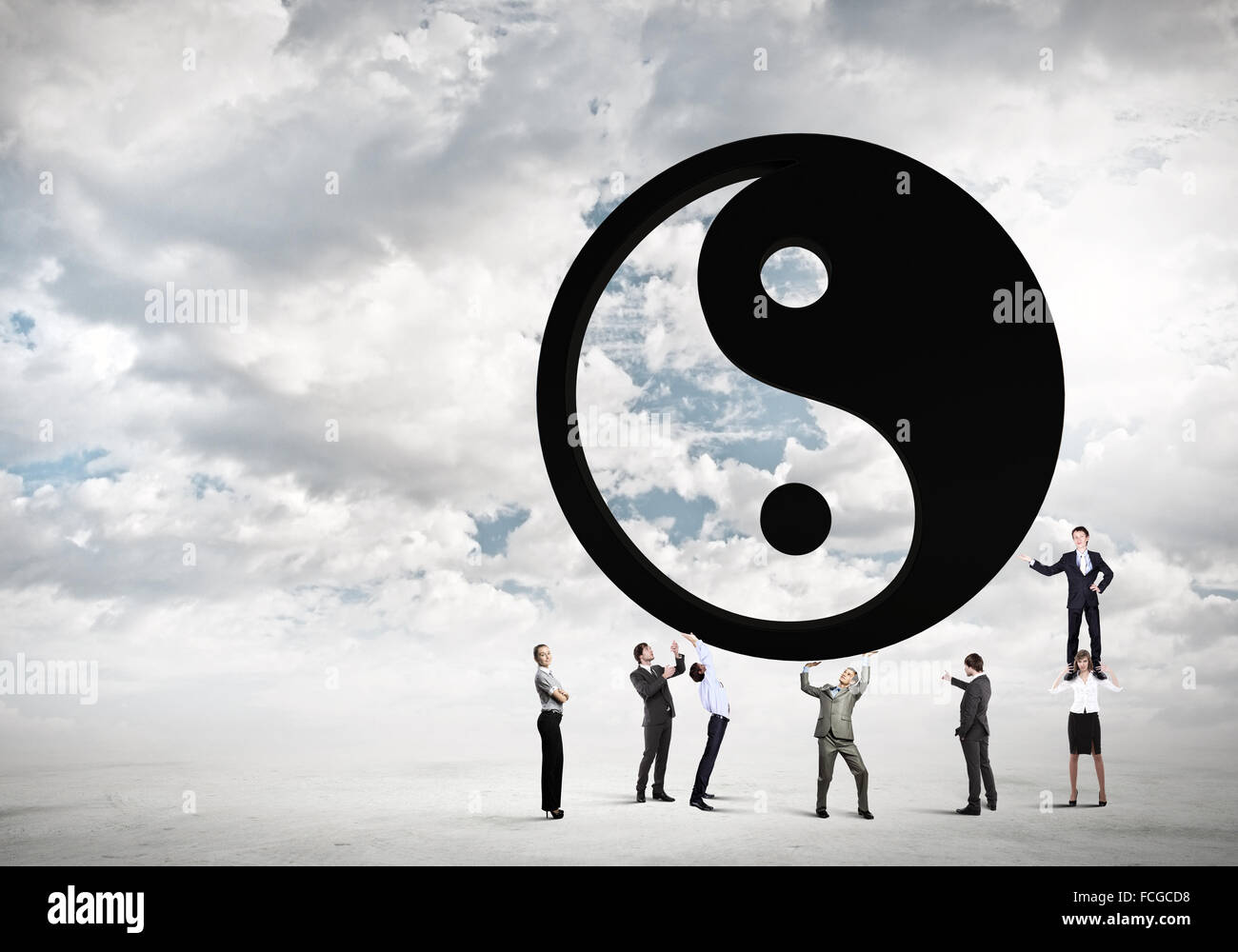 Group of businesspeople and yin yang sign Stock Photo - Alamy