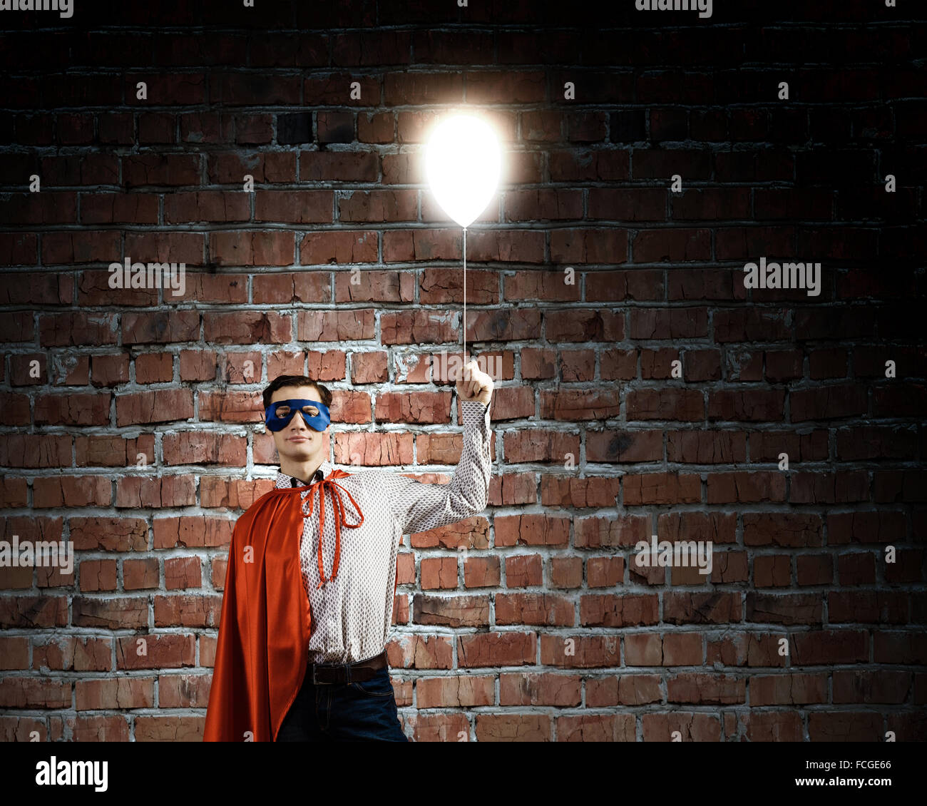 Young confident superman in mask and cape Stock Photo - Alamy