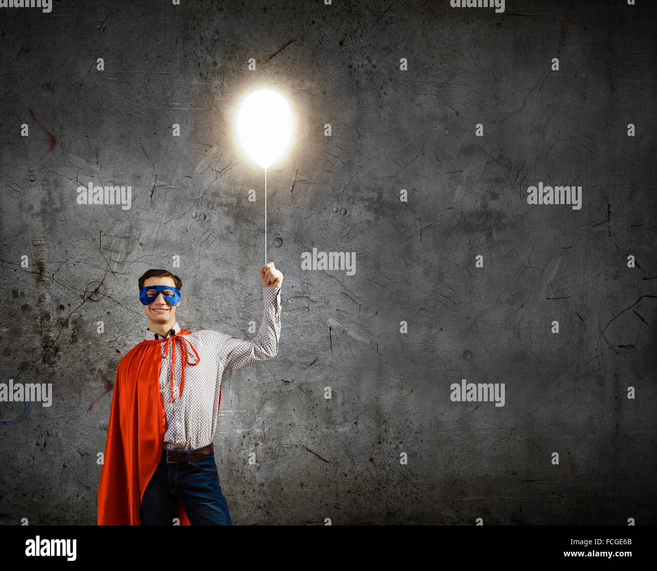Young confident superman in mask and cape Stock Photo - Alamy
