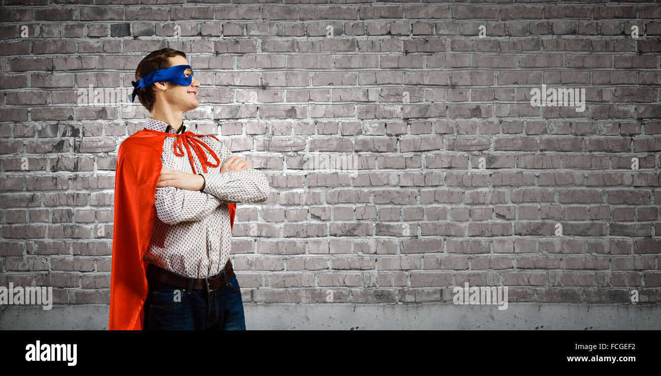 Young confident superman in mask and cape Stock Photo - Alamy