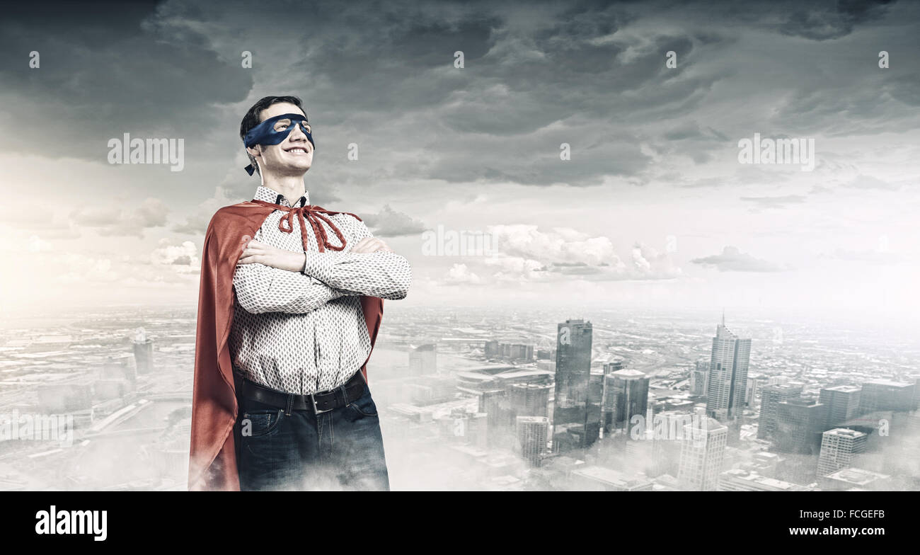 Young confident superman in mask and cape Stock Photo - Alamy