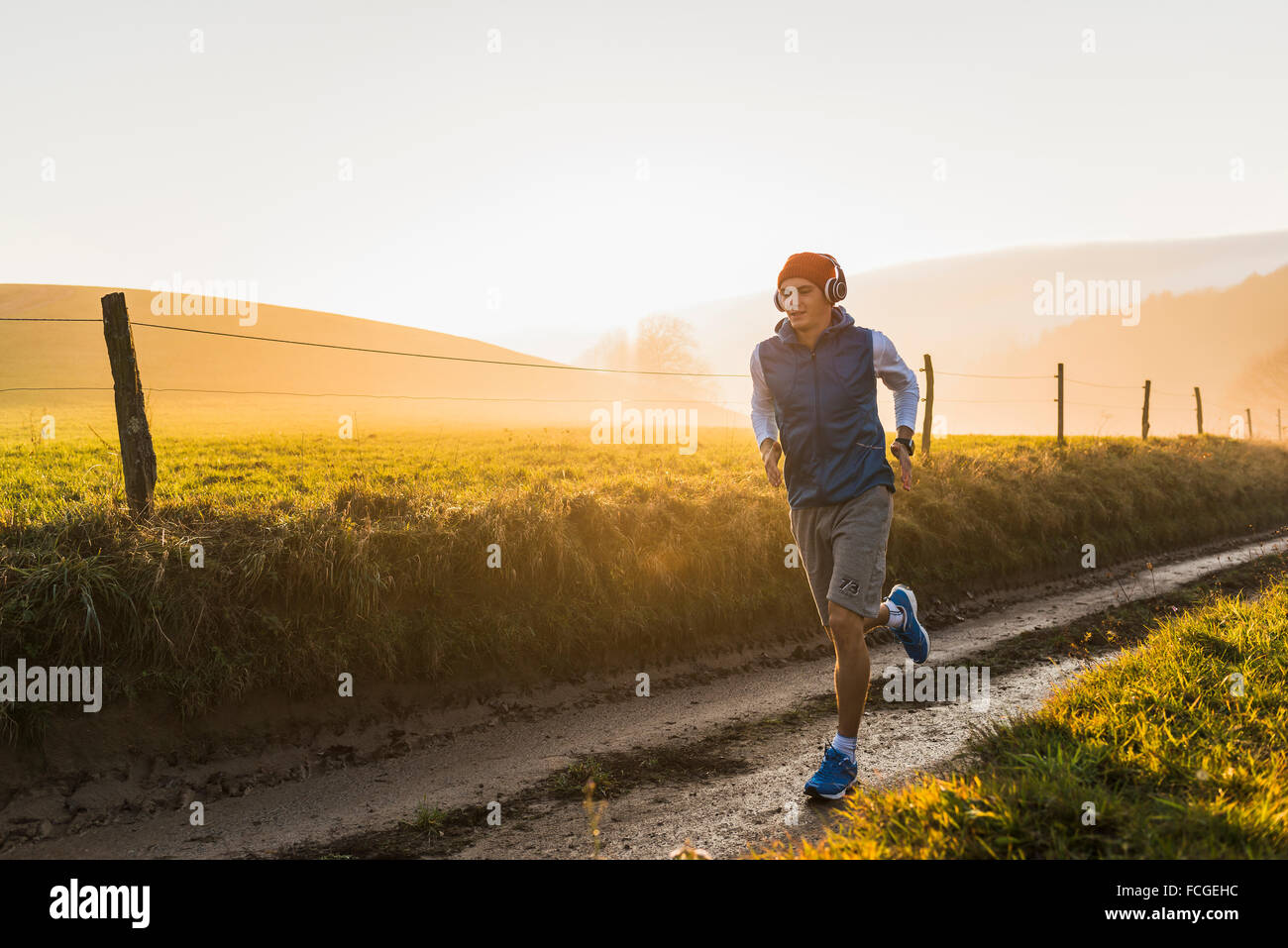 Young man jogging in the morning Stock Photo - Alamy