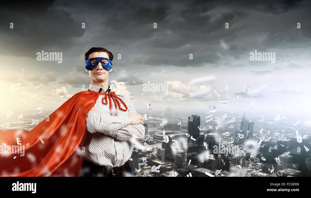 Young confident superman in mask and cape Stock Photo - Alamy