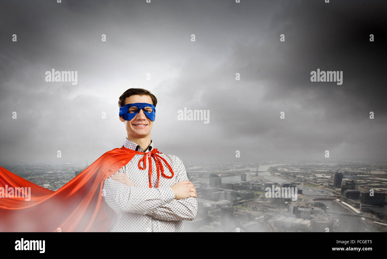 Young confident superman in mask and cape Stock Photo - Alamy