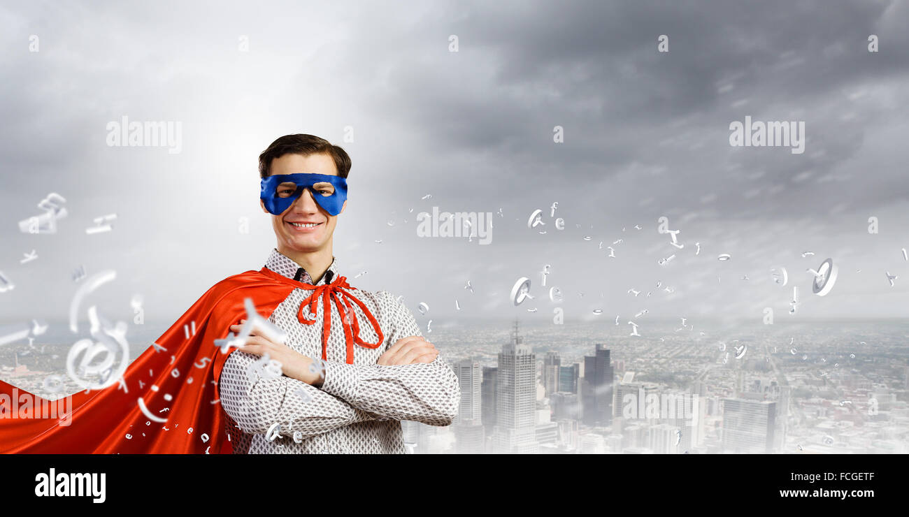 Young confident superman in mask and cape Stock Photo - Alamy