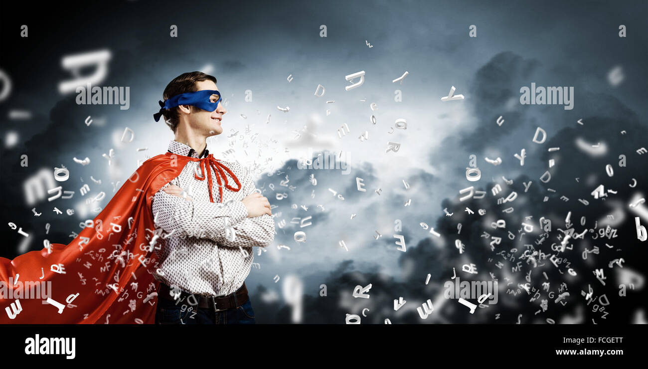 Young confident superman in mask and cape Stock Photo - Alamy