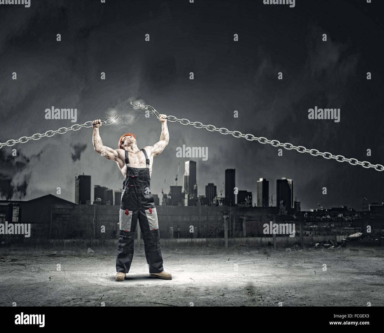 Strong man in uniform tearing metal chain with hands Stock Photo - Alamy