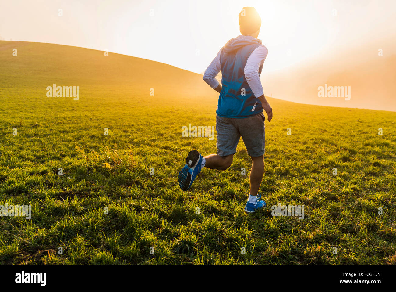 Young man jogging in the morning Stock Photo - Alamy