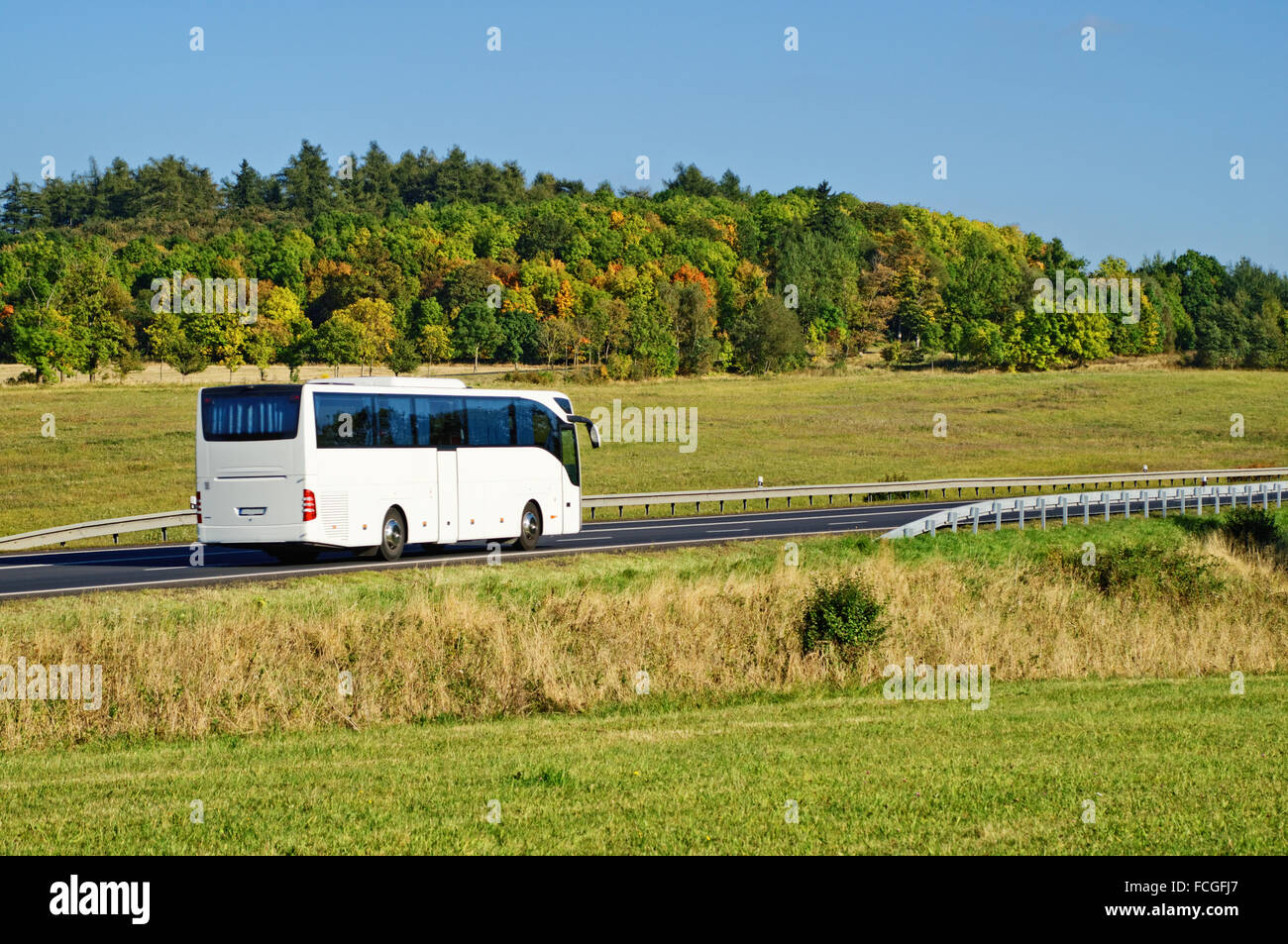 White bus on the road in the countryside, fall colors Stock Photo - Alamy