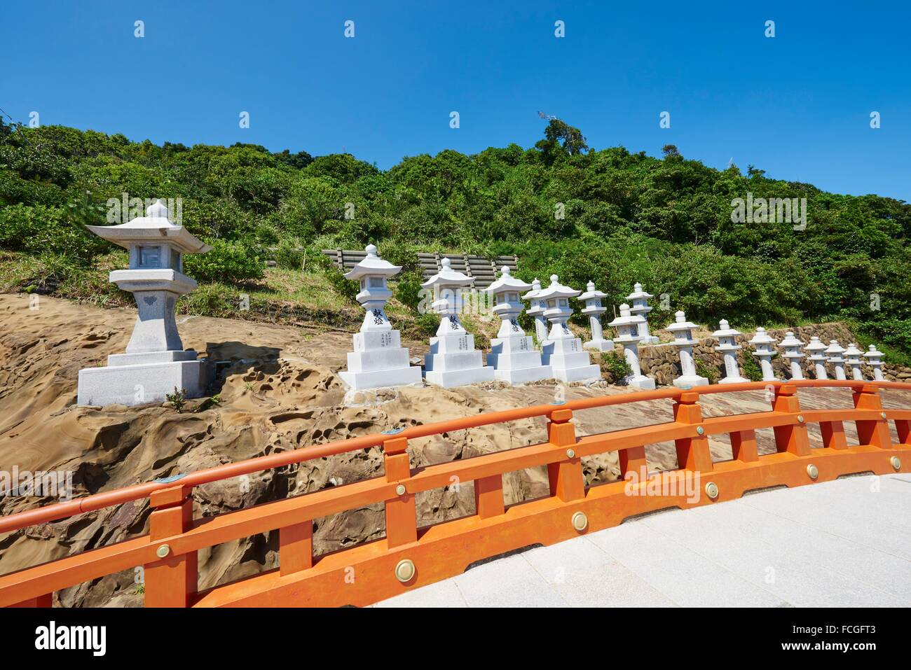Japanese stone lanterns lined up at Udo-jingu, a taoist shrine in ...