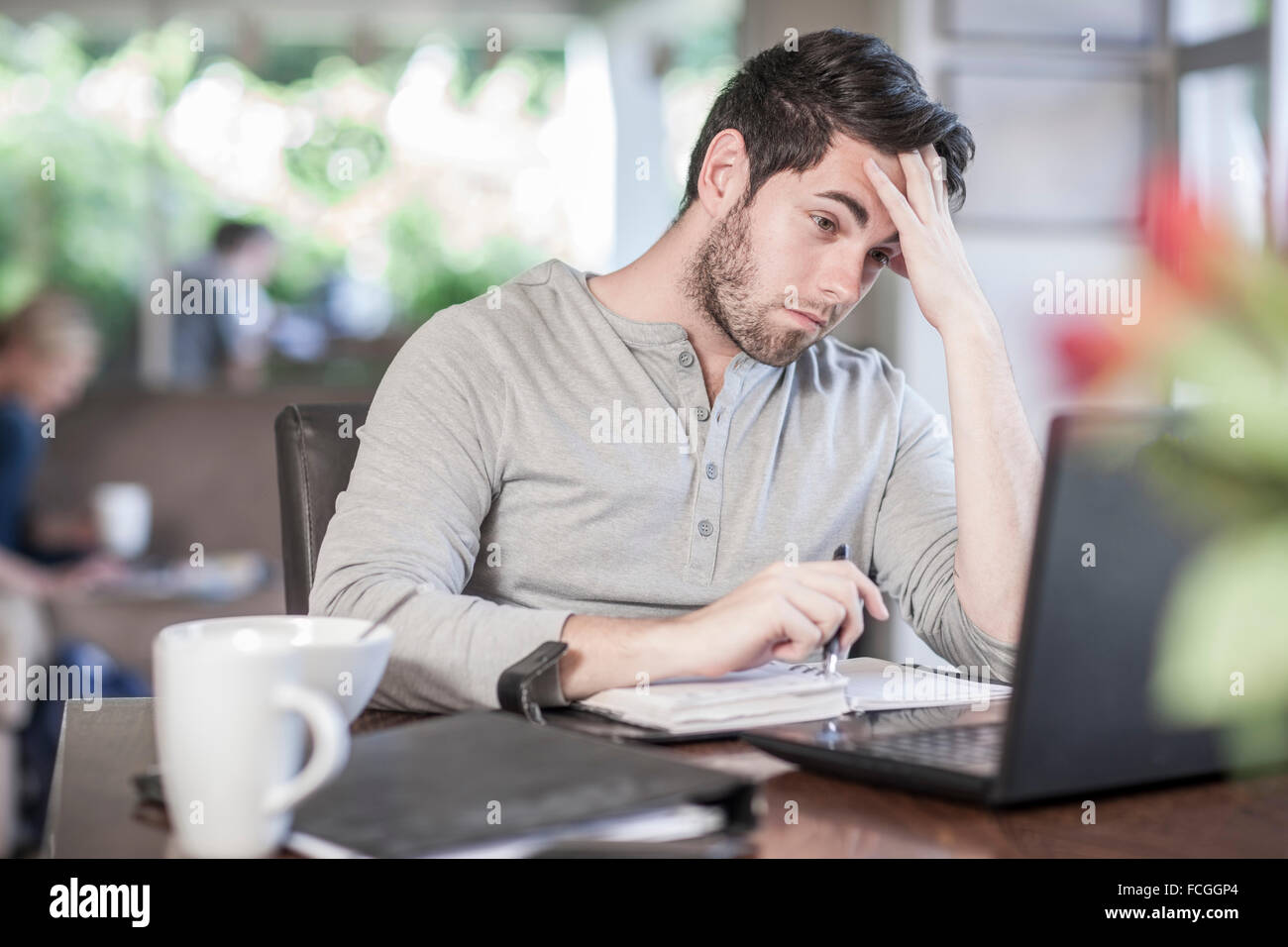 Man frustrated dining table hi-res stock photography and images - Alamy
