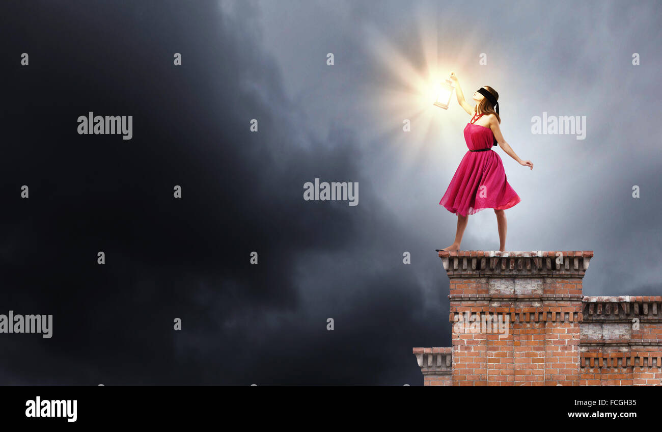 Young woman in red dress with lantern Stock Photo - Alamy