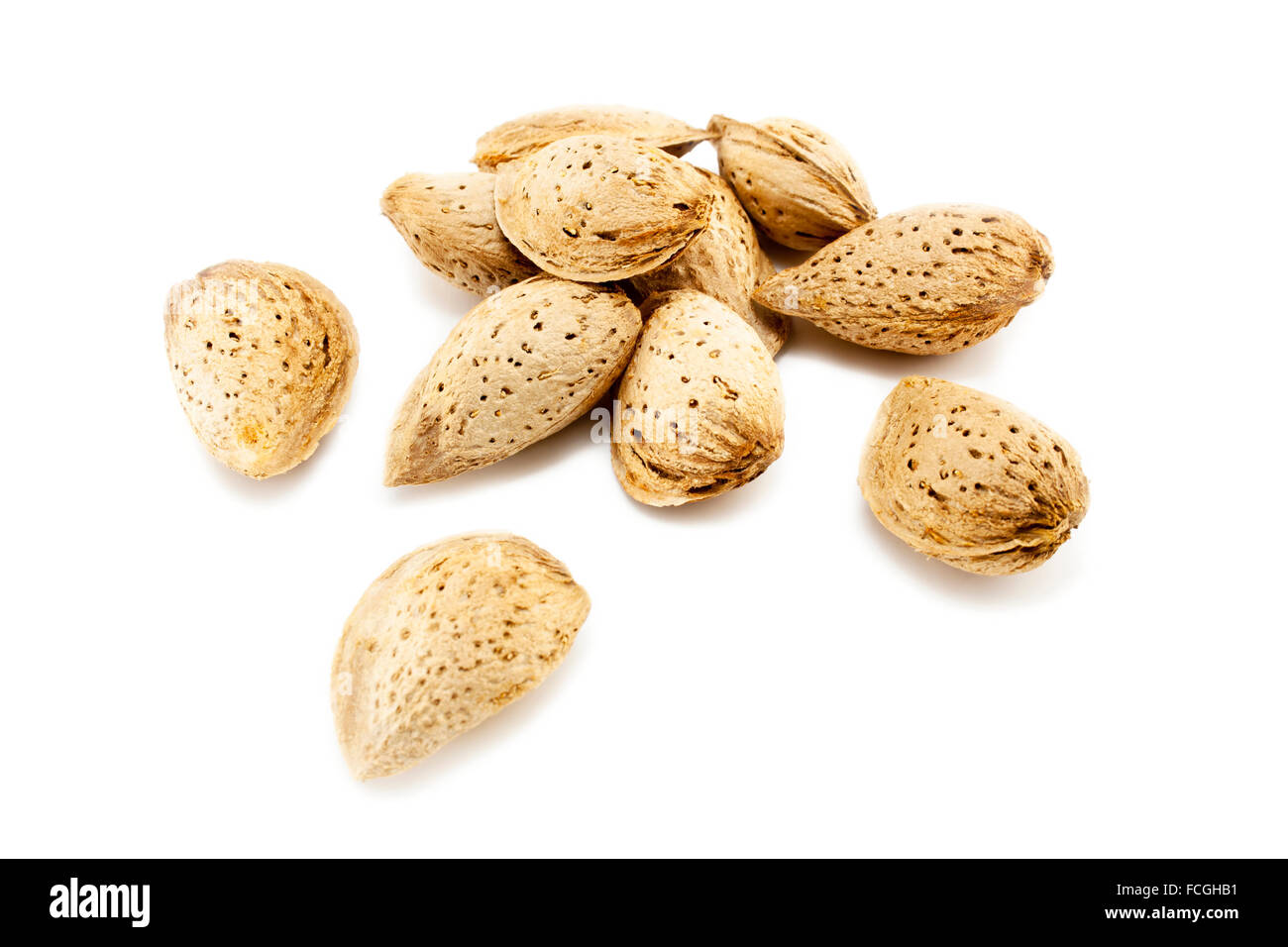 Pile of almonds isolated on white background Stock Photo - Alamy