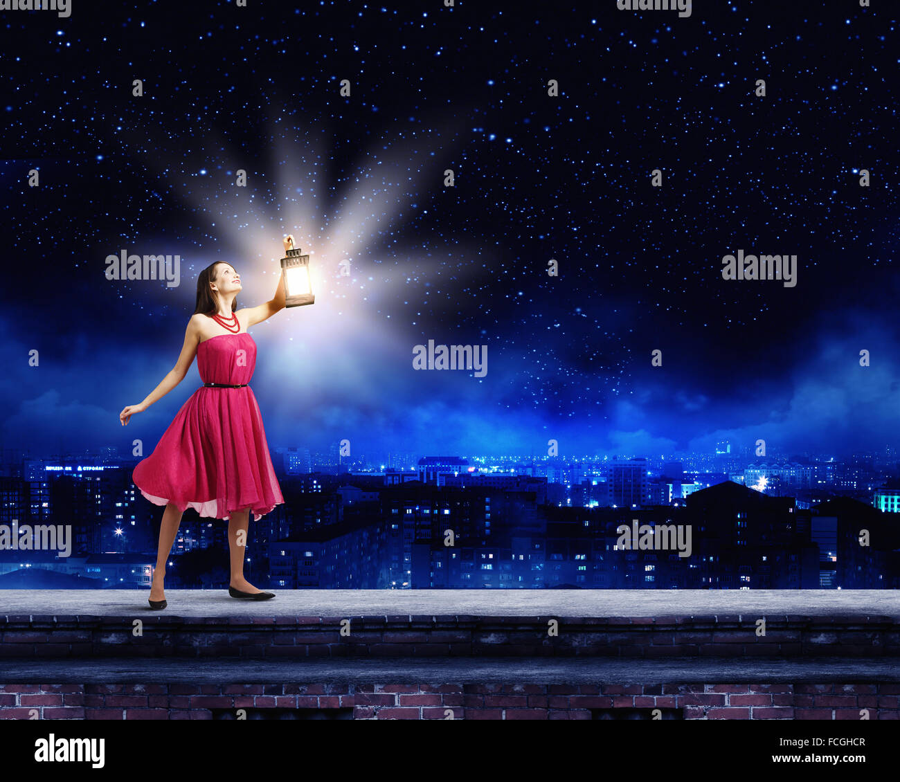 Young woman in red dress with lantern Stock Photo - Alamy