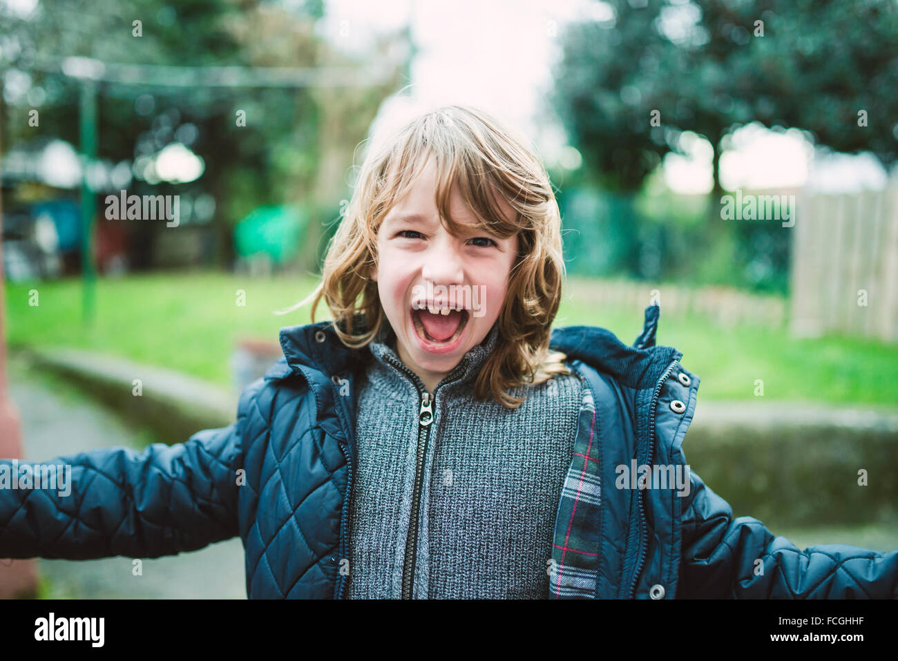 Portrait of screaming blond boy Stock Photo - Alamy