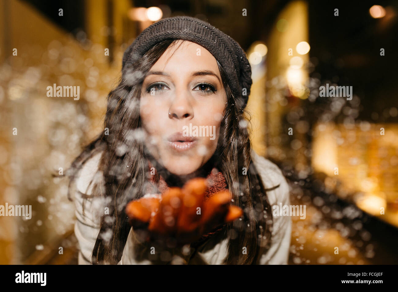 Beautiful caucasian woman blowing snow hi-res stock photography and images - Alamy