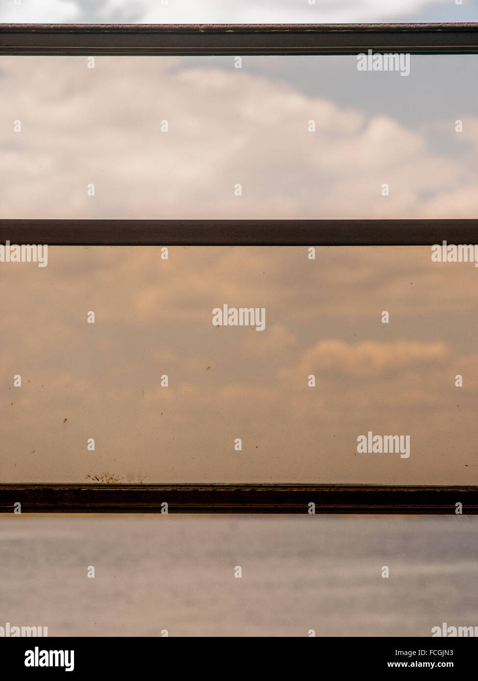 Different hues of the sky through staten island ferry window, New York ...