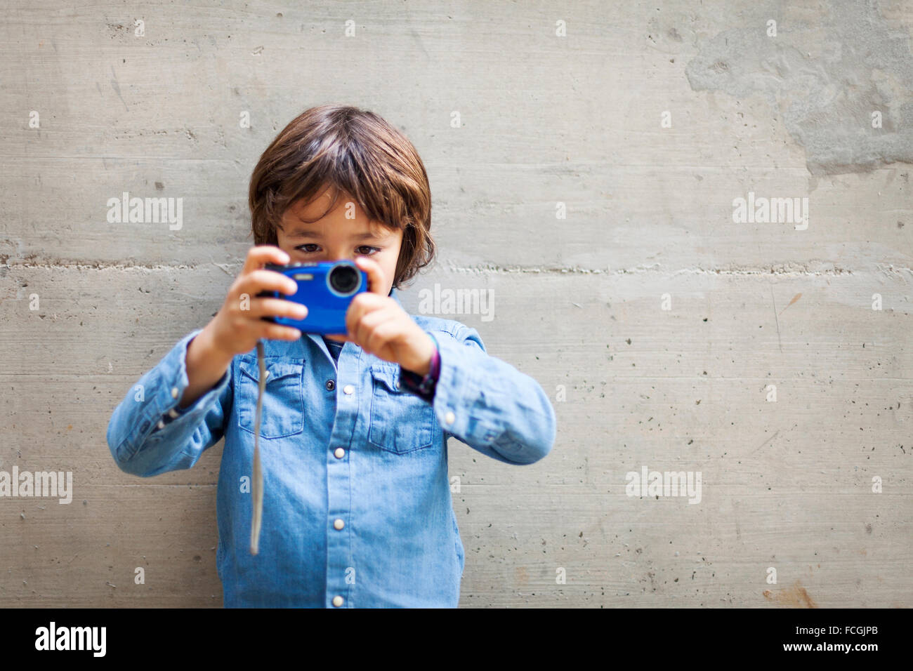 Little boy taking a picture digital camera Stock Photo - Alamy
