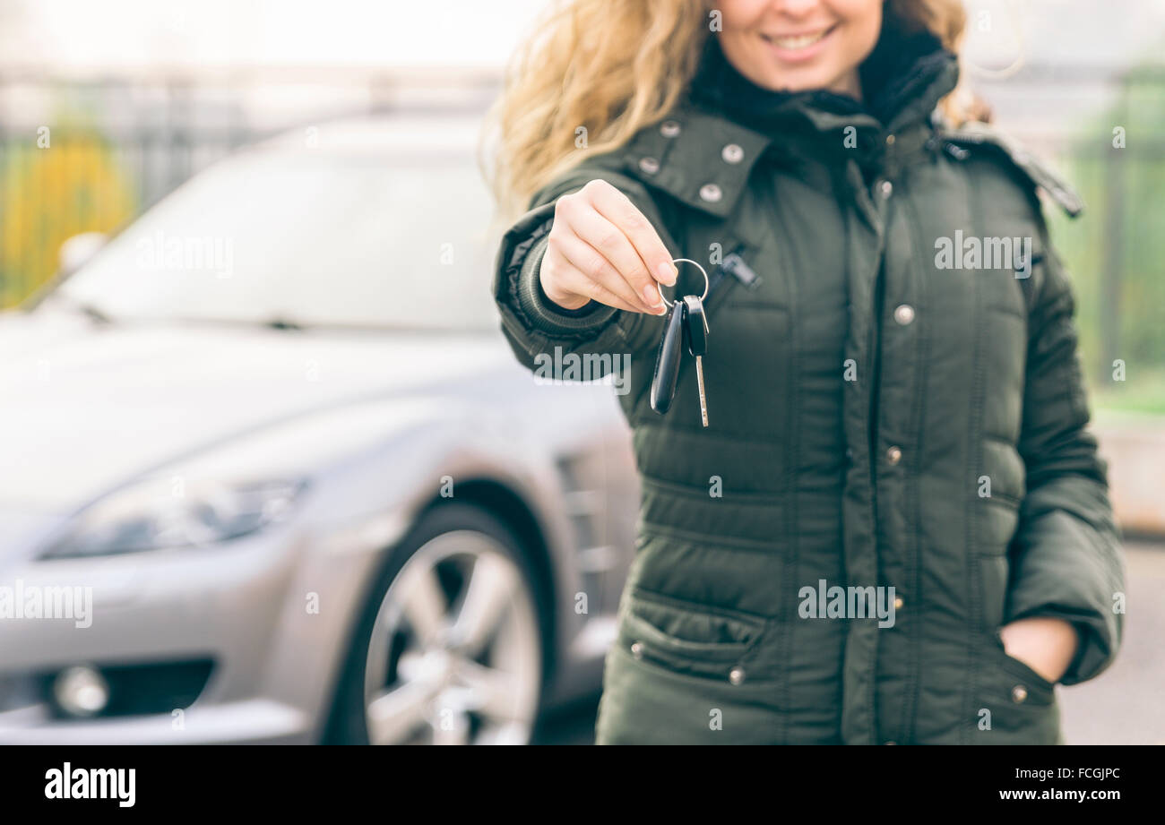 Woman showing the car keys Stock Photo - Alamy