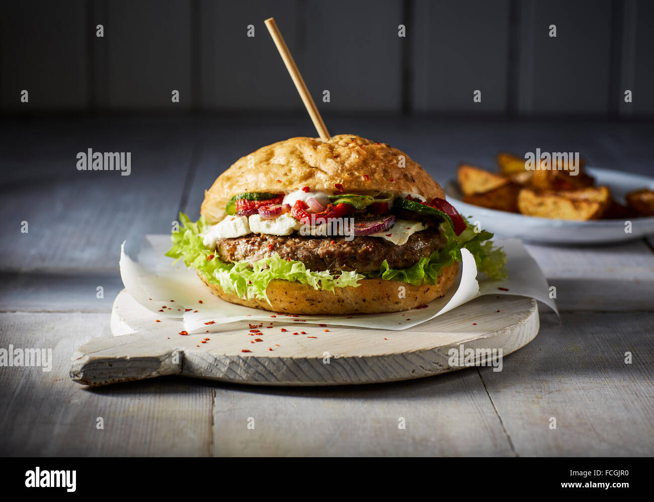 Cheeseburger and potato wedges Stock Photo - Alamy
