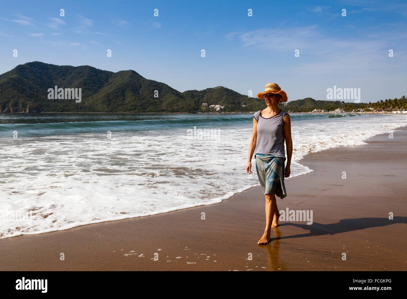 Woman walking on the beach, Pacific Ocean, Manzanillo, Colima, Mexico ...