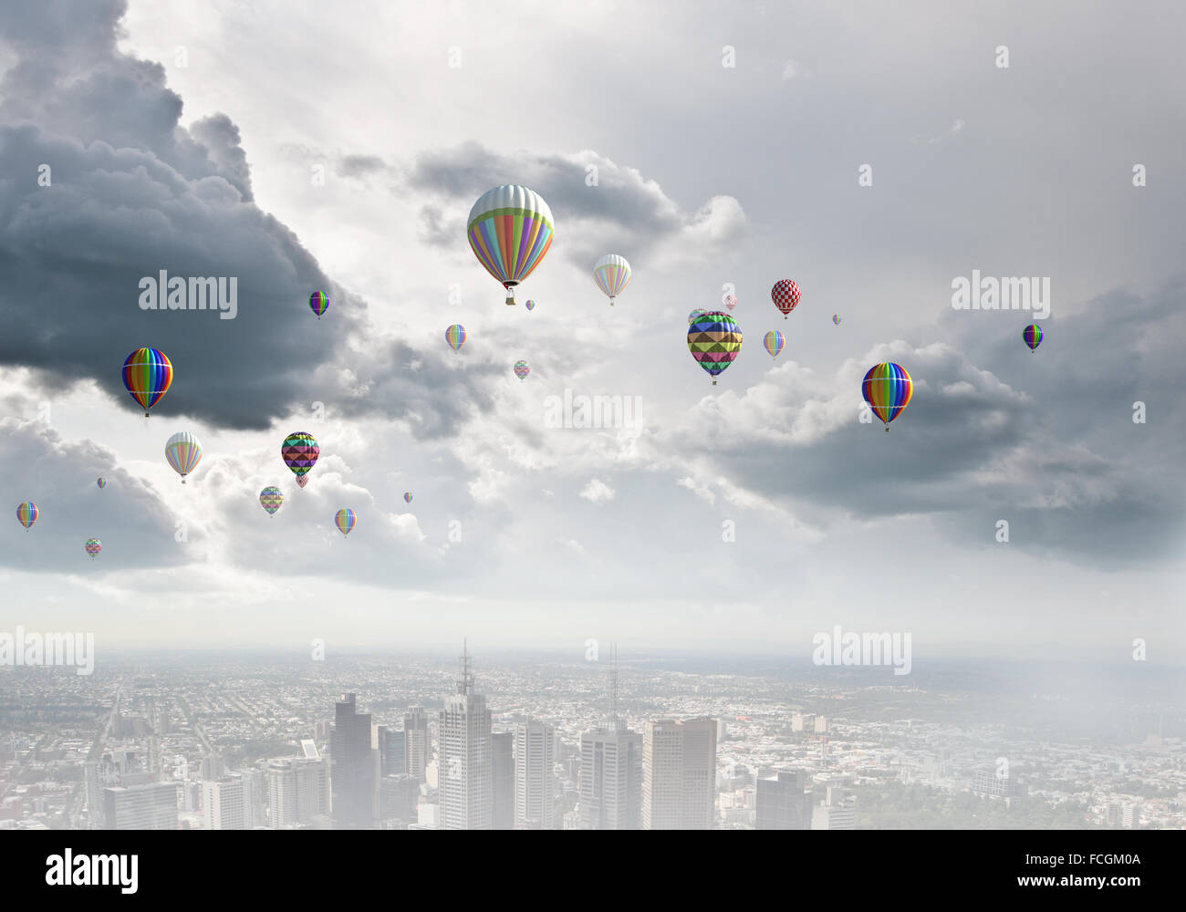 Colorful aerostats flying in clear sky above modern city Stock Photo ...