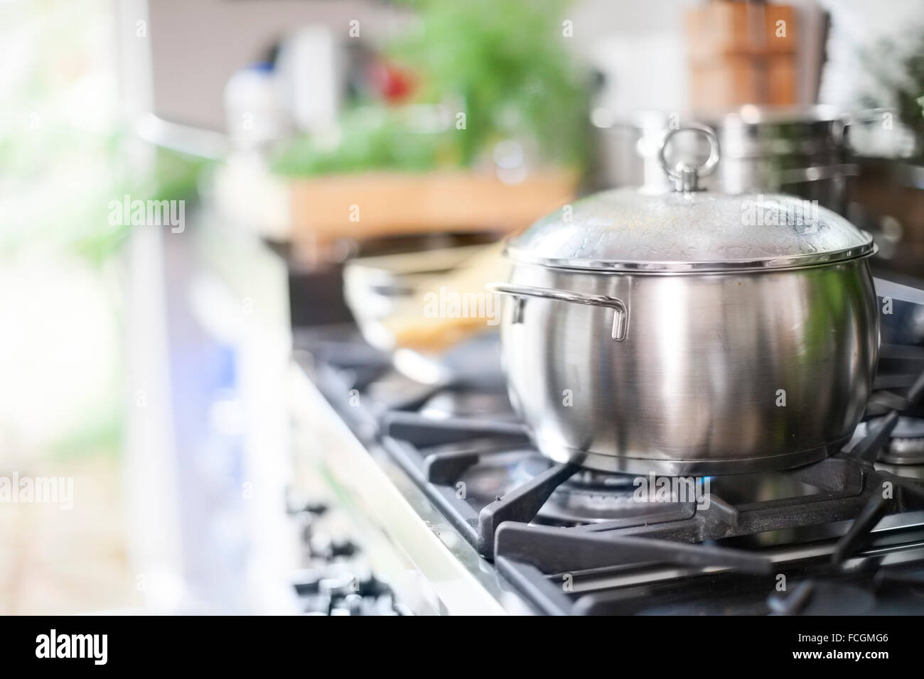 Pot on stove hi-res stock photography and images - Alamy