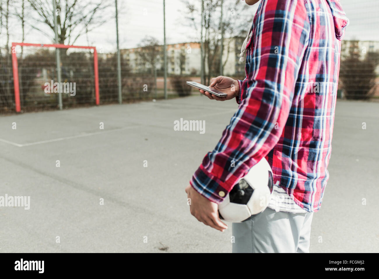 Young football player smartphone Stock Photo - Alamy