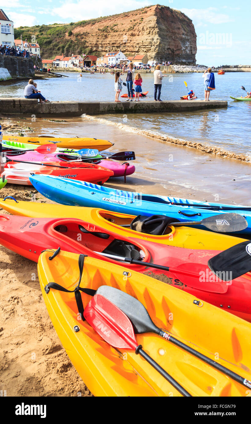 Brightly coloured kayaks on the beach in Staithes, North Yorkshire ...