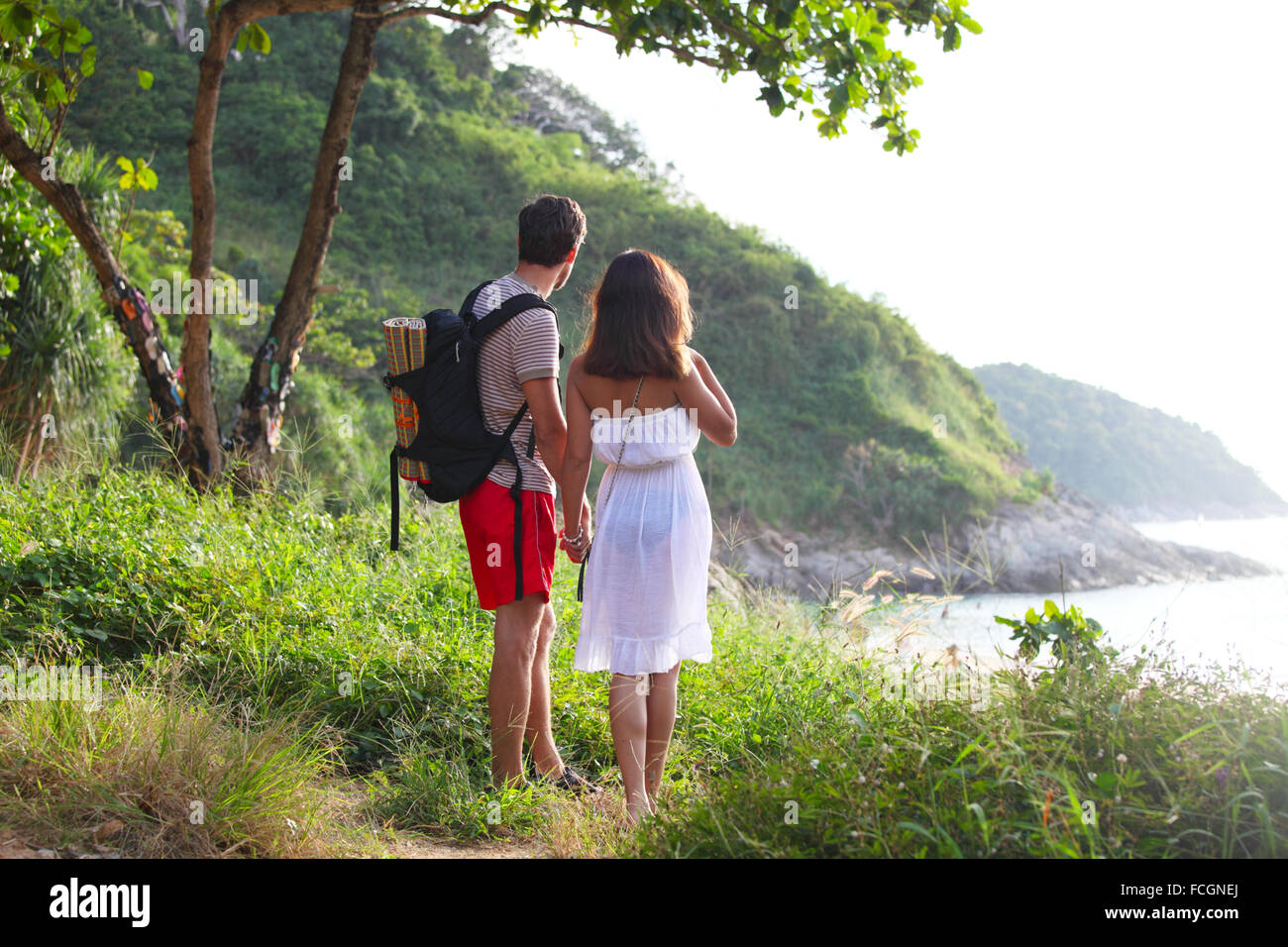 Young man and young woman looking at sea view hi-res stock photography ...