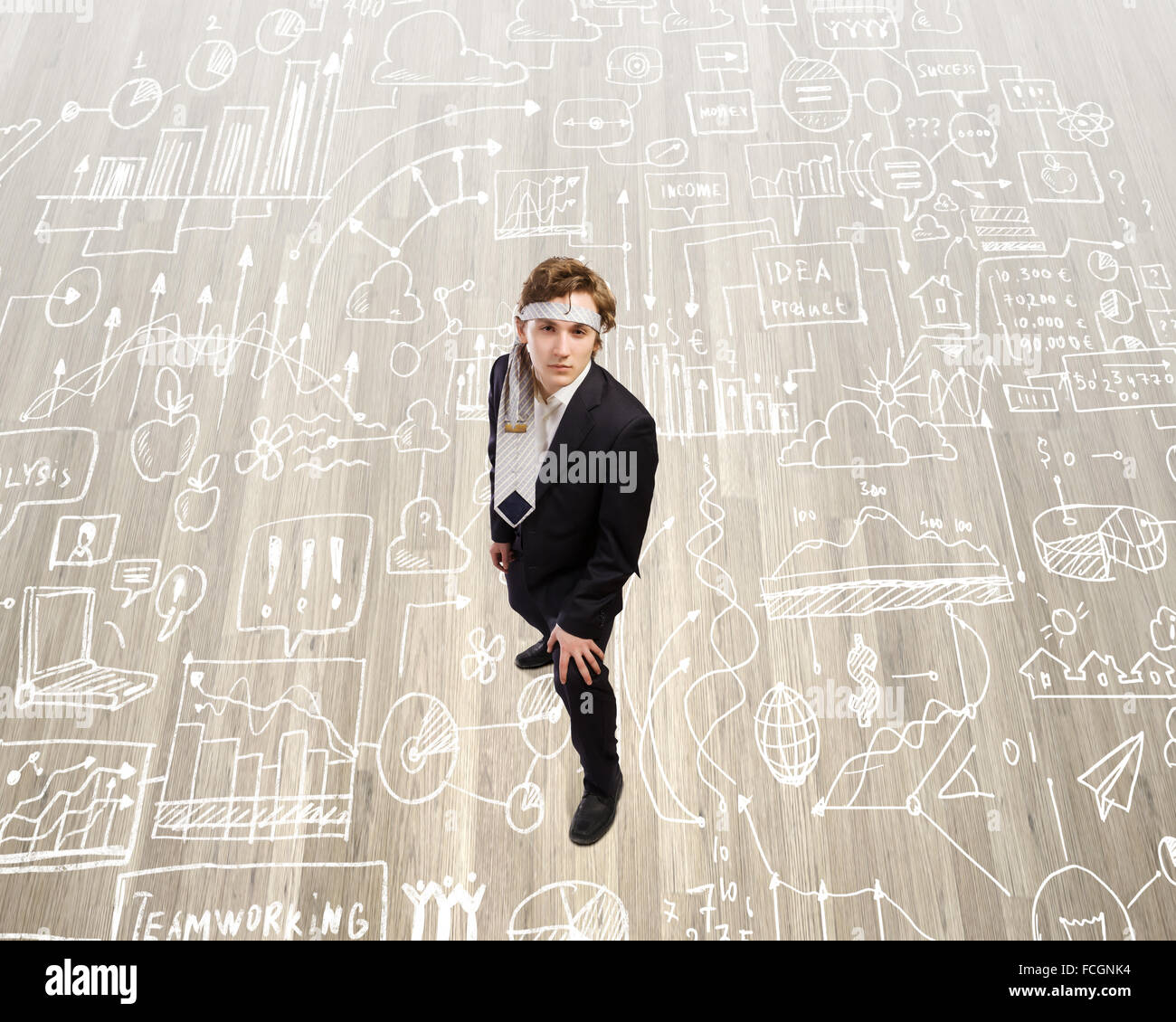 Top view of young businessman with tie around head Stock Photo - Alamy