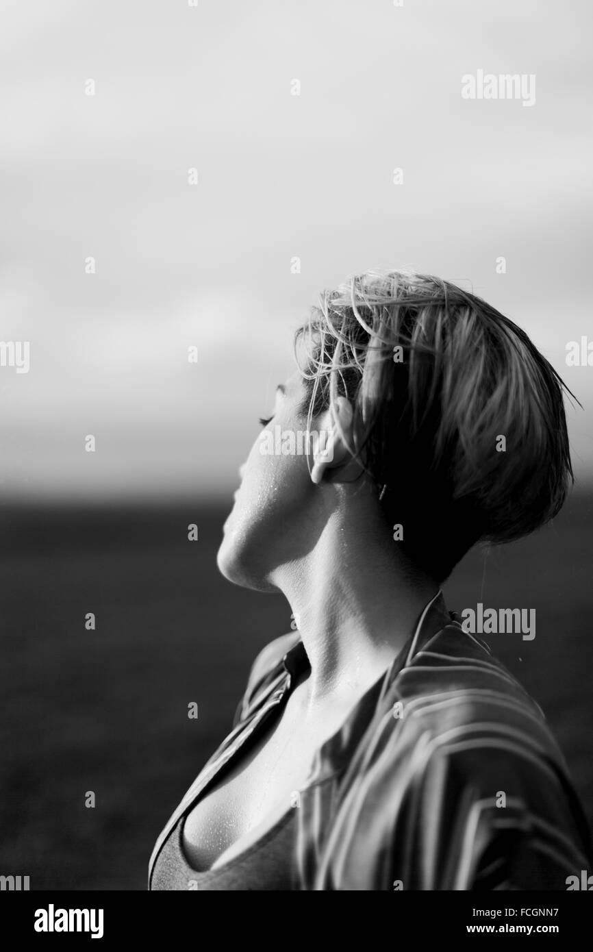 Woman turning her head Stock Photo - Alamy