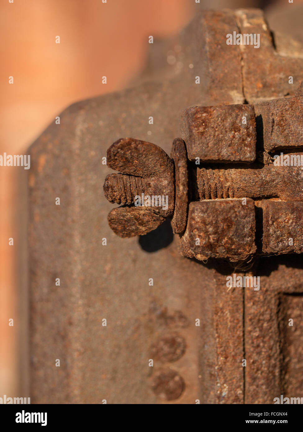 Rusty wing nut and bolt fastened in wall Stock Photo - Alamy