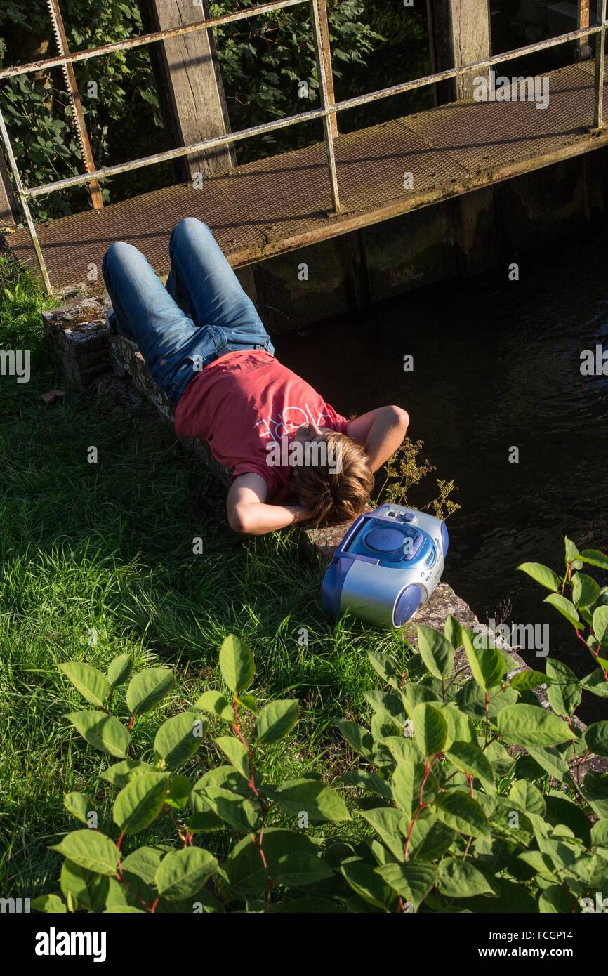 TEENAGER AND MUSIC IN NATURE Stock Photo - Alamy