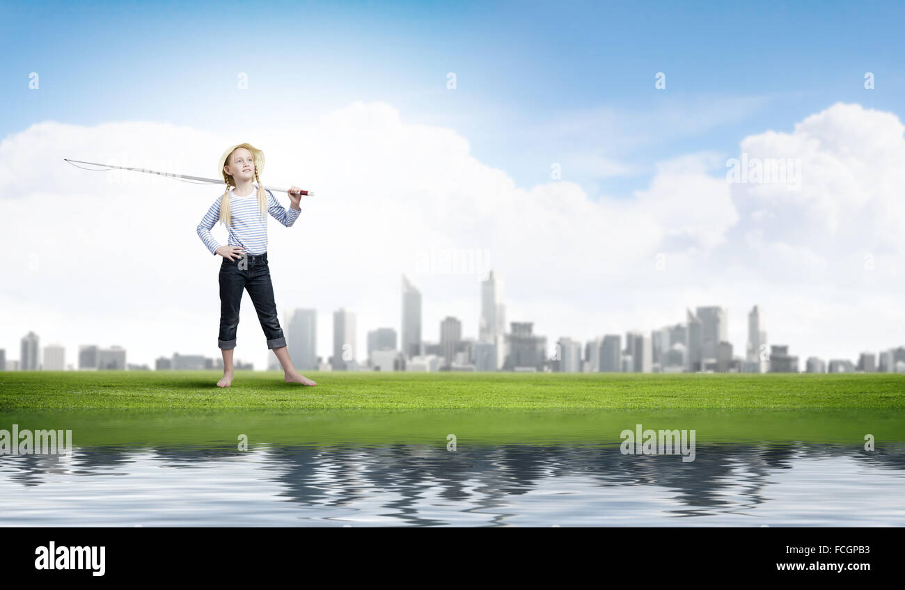 Cute girl of school age with fishing rod Stock Photo - Alamy