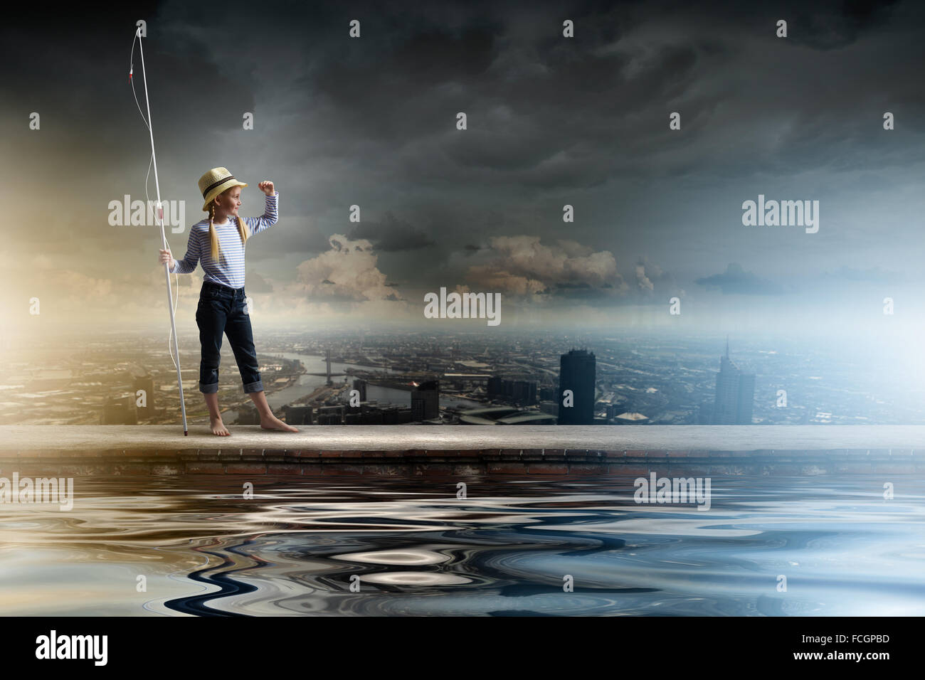 Cute girl of school age with fishing rod Stock Photo - Alamy