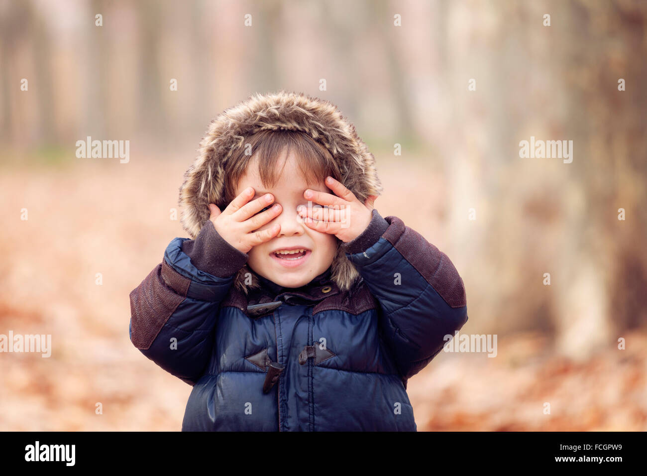Funny boy hooded jacket see no evil Stock Photo - Alamy