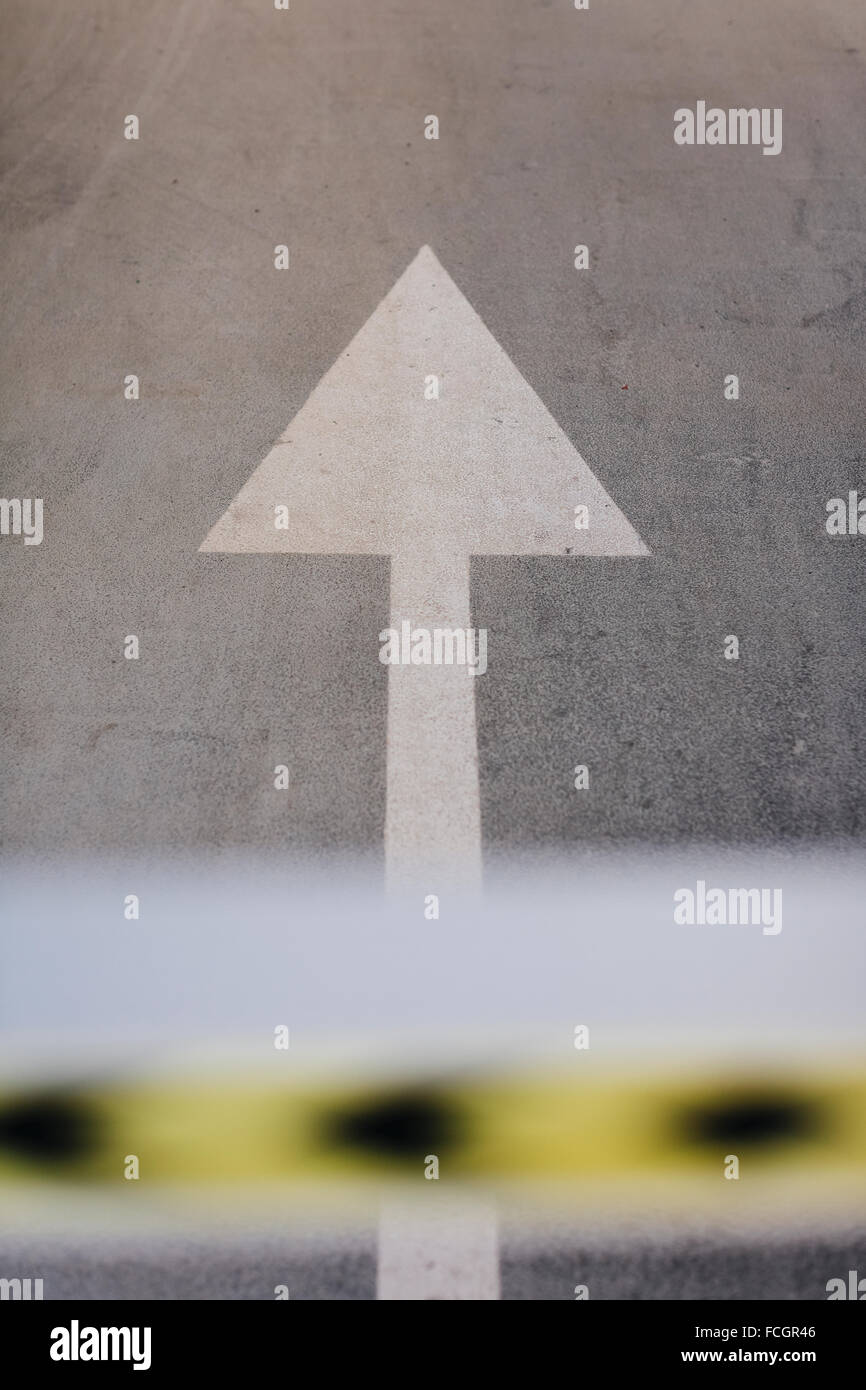 Directional arrow on a lane Stock Photo - Alamy