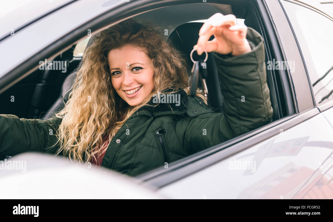 Woman showing the car keys Stock Photo - Alamy