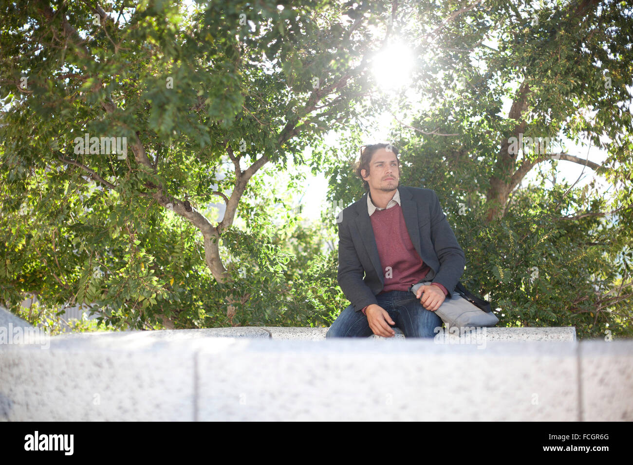 Man sitting in park Stock Photo - Alamy