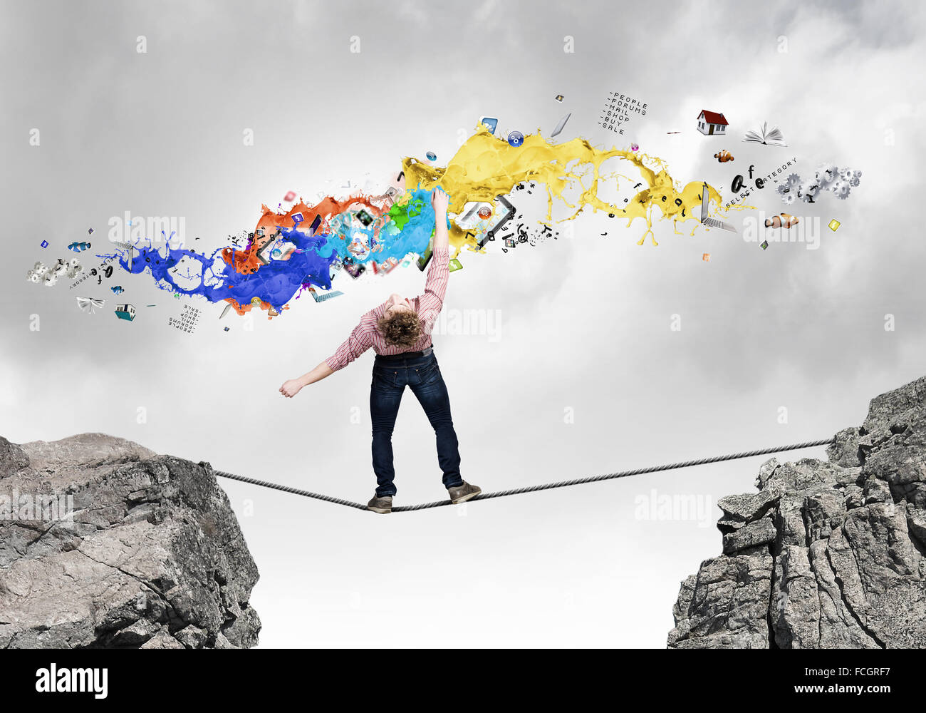 Young man in casual evading from flying icons Stock Photo - Alamy