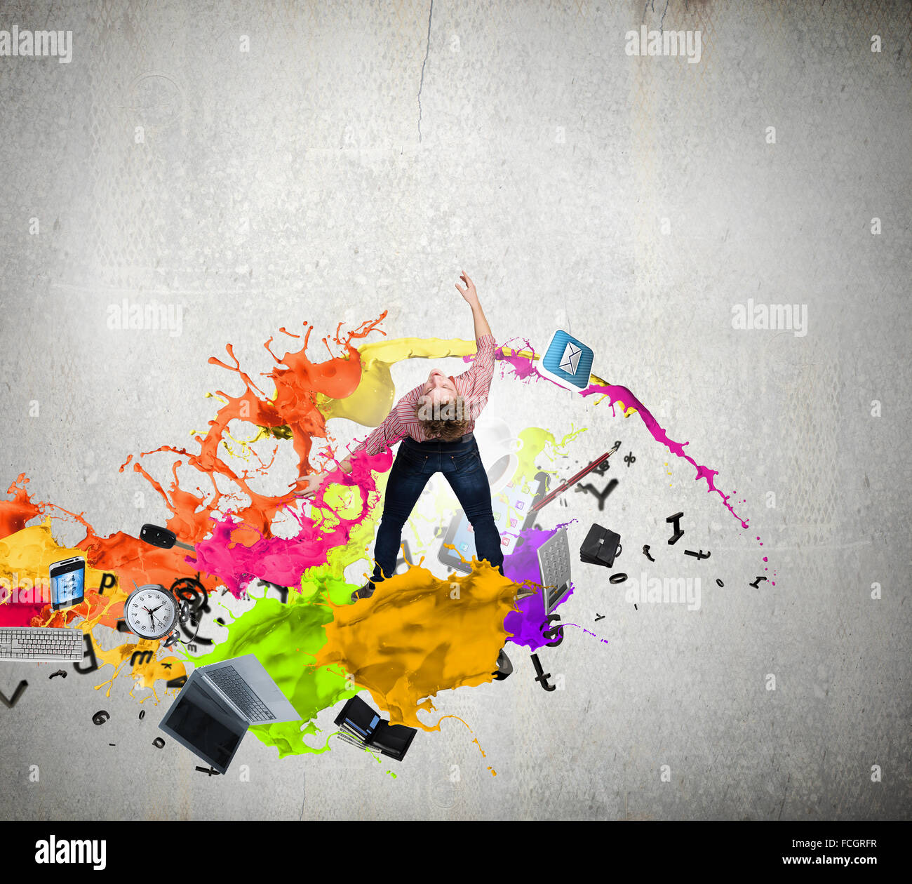 Young man in casual evading from flying icons Stock Photo - Alamy