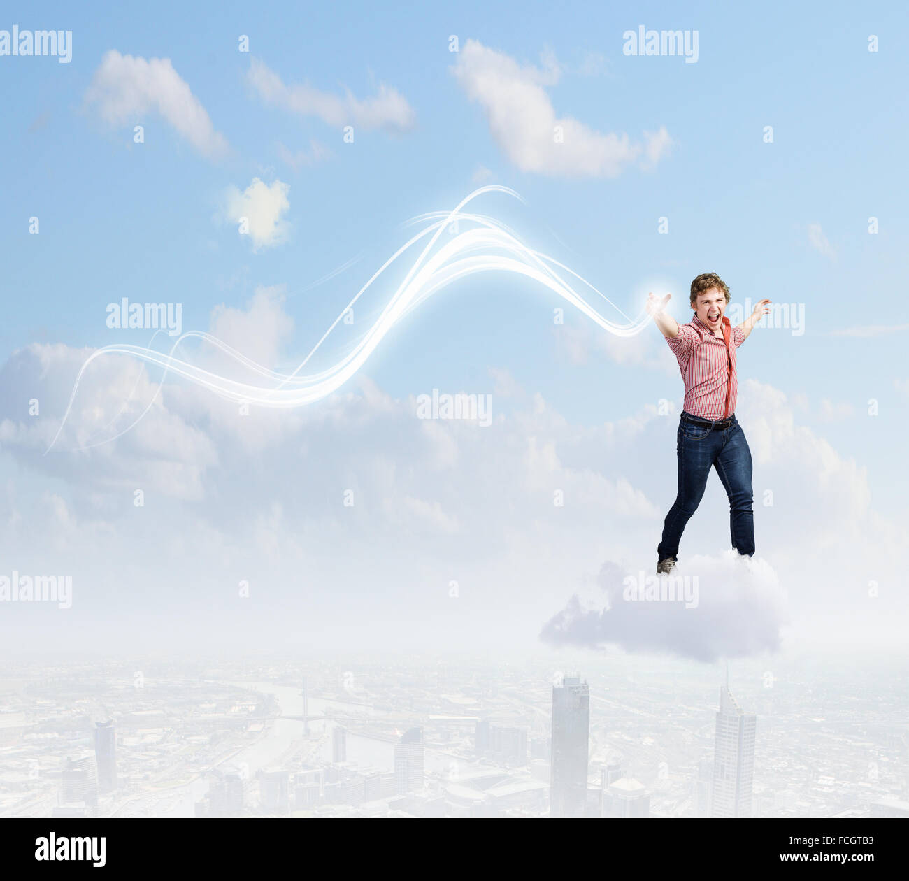 Young man in casual throwing light splashes Stock Photo - Alamy